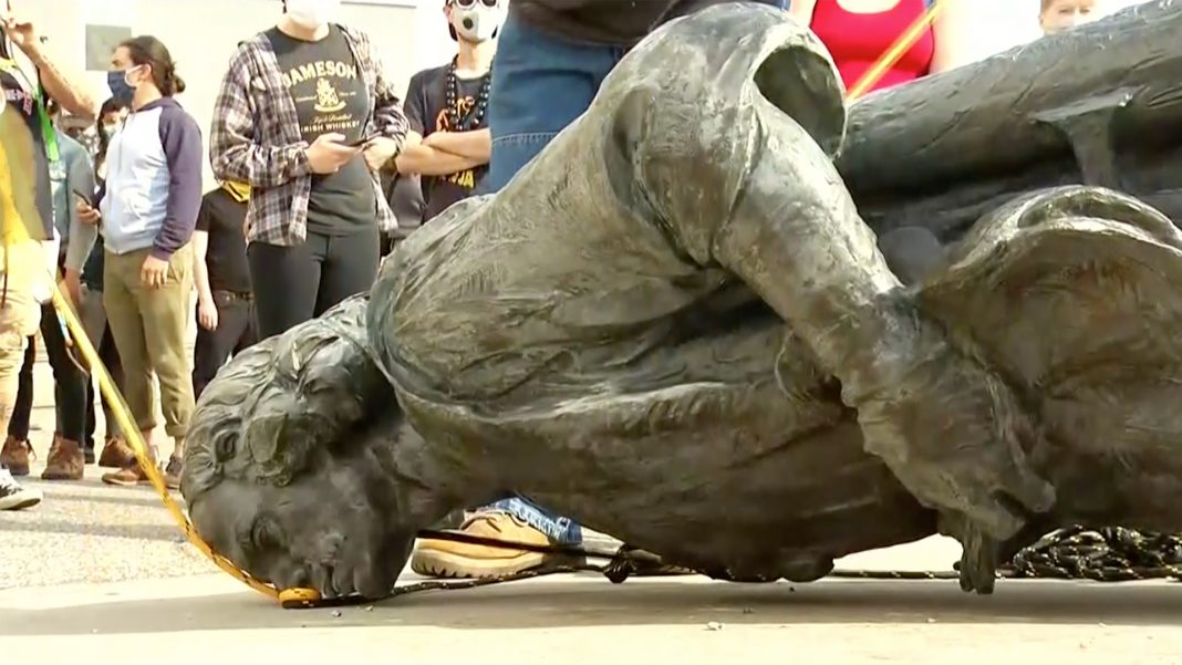 Protesters pull down Christopher Columbus statue in Baltimore